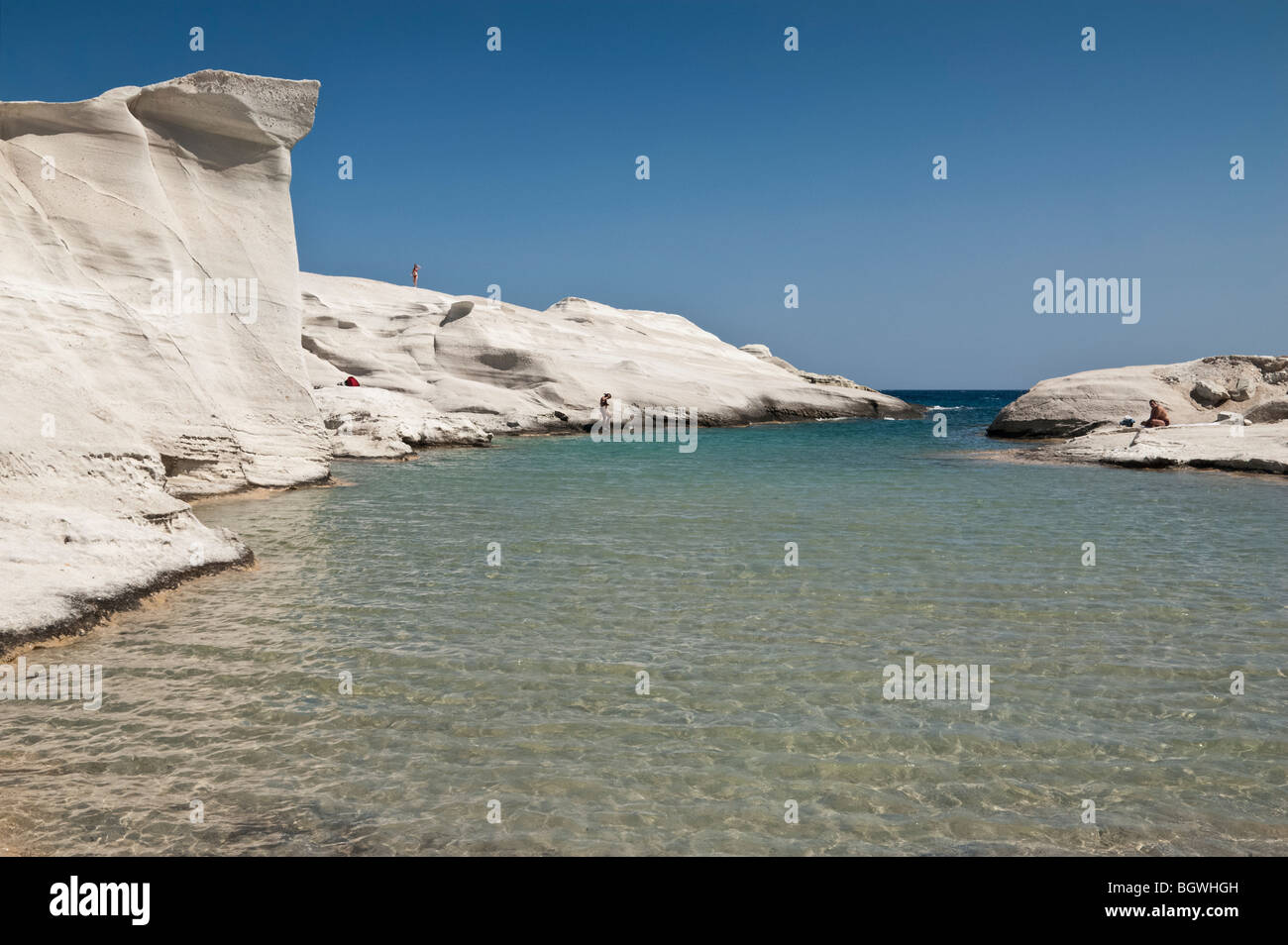 People on the white volcanic rocks of Sarakiniko, Milos Island, Greece ...