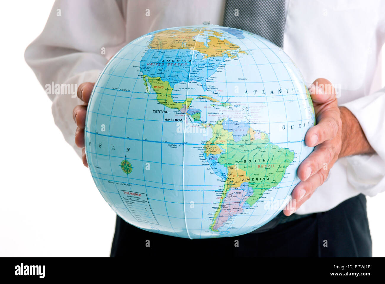 Man holding a globe in his hand Stock Photo - Alamy