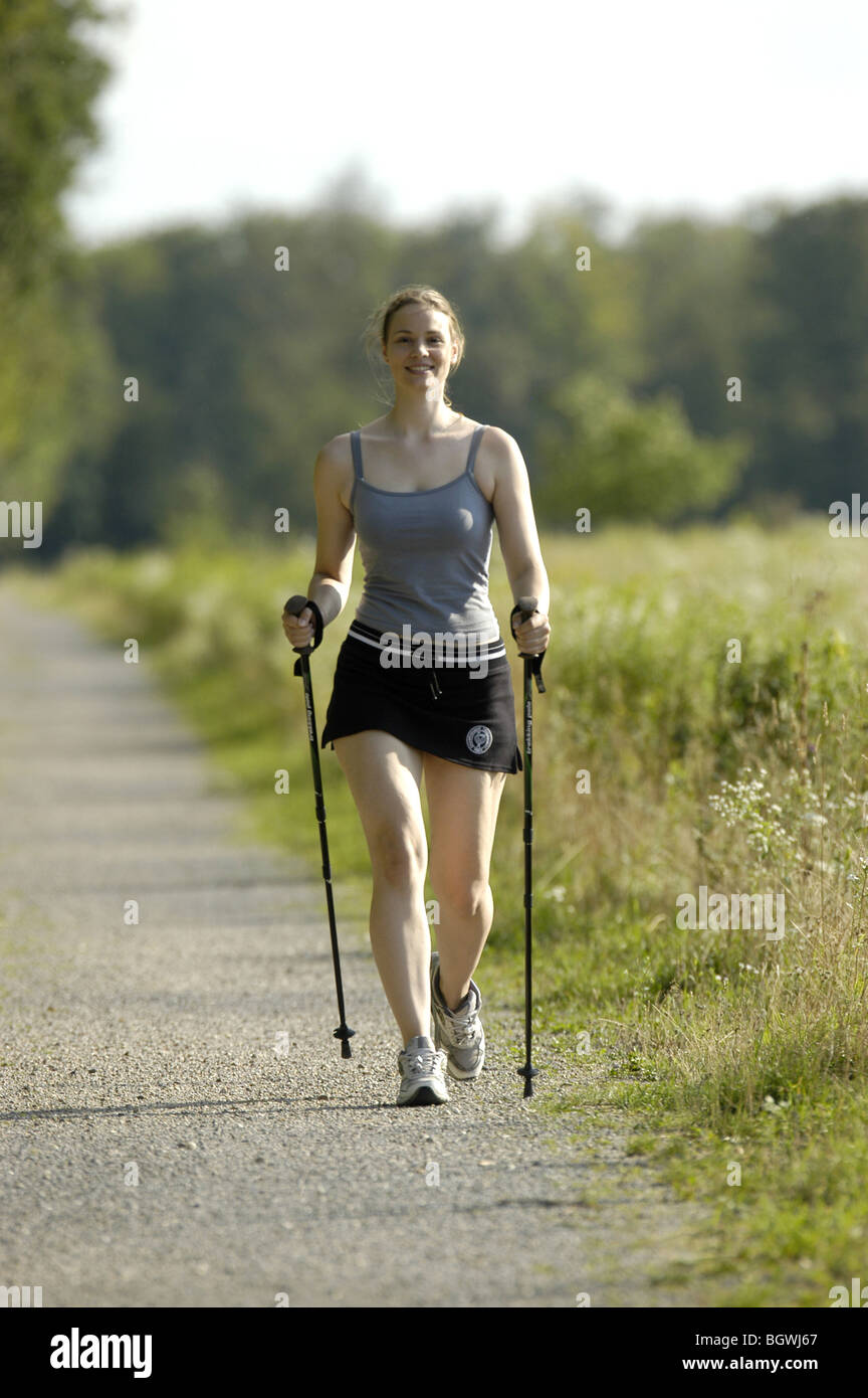 Young woman Nordic walking Stock Photo - Alamy