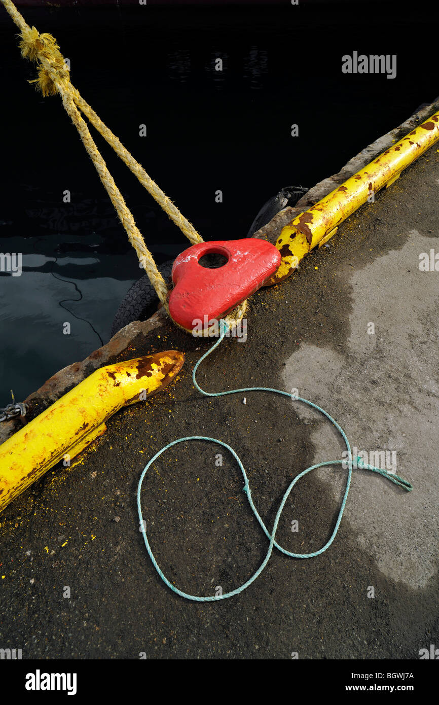 Ship moored to a red bollard with a mooring cable Stock Photo - Alamy
