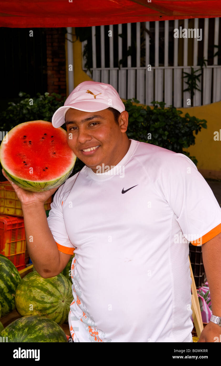 Local man selling watermelon in Central Market with fruits and ...