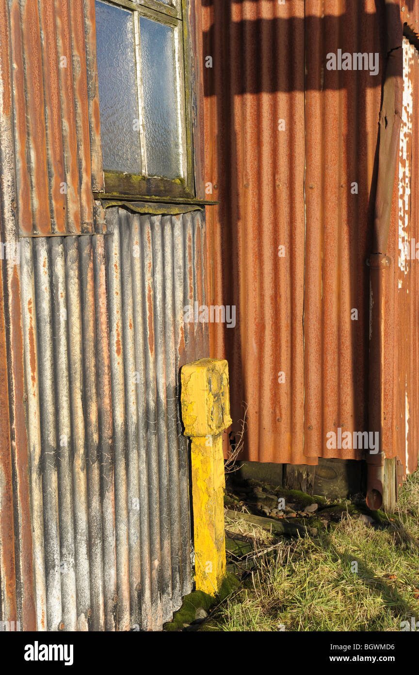 Rusty corrugated iron shed and hydrant signs Stock Photo - Alamy