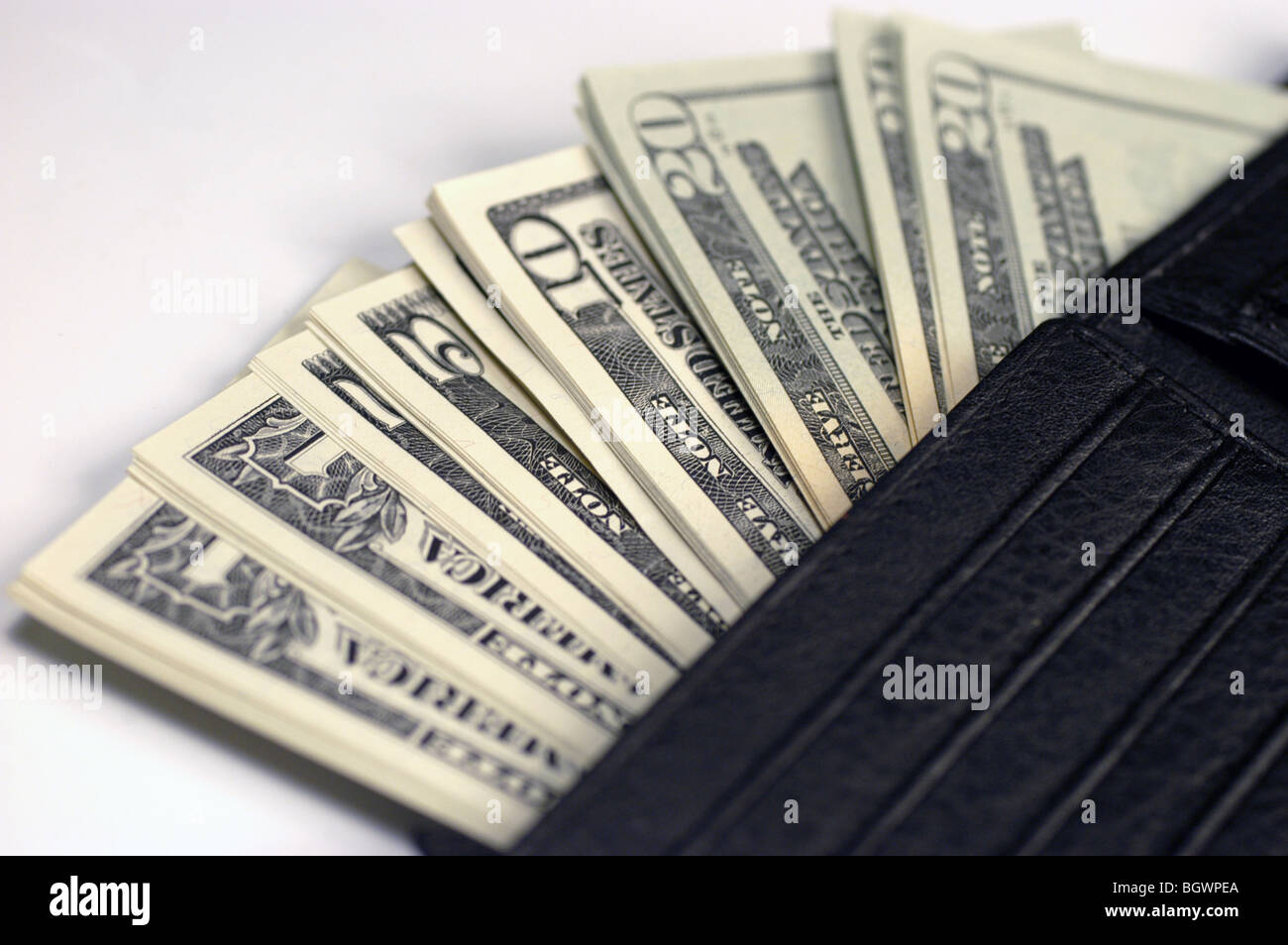 Dollar bills in a wallet Stock Photo - Alamy