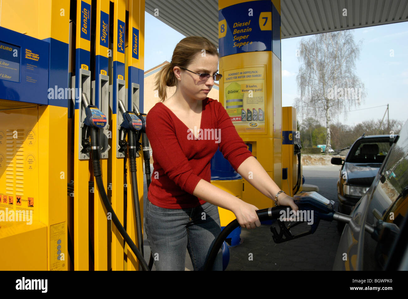 female driver fuels Stock Photo - Alamy