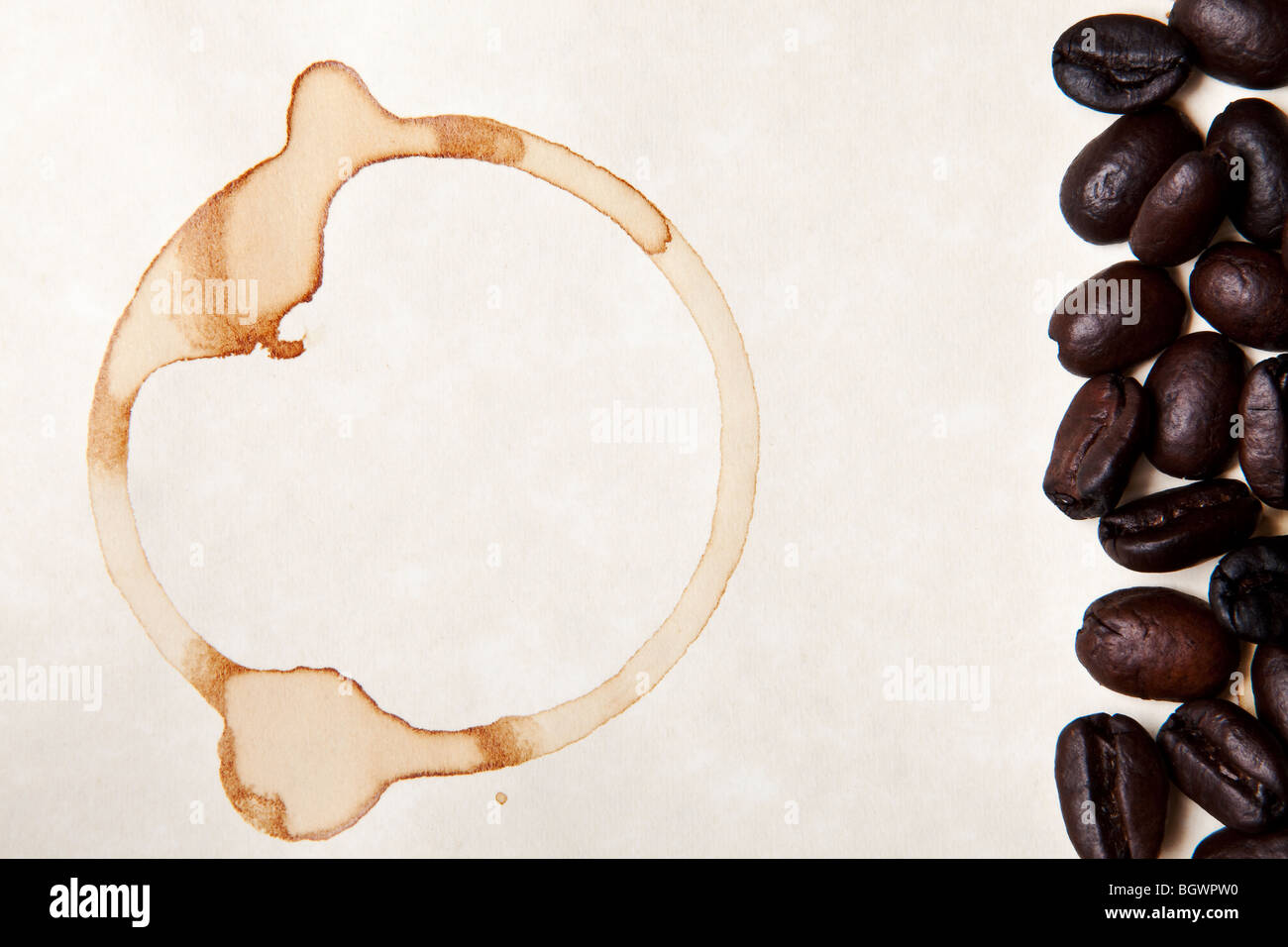 coffee beans on a parchment paper background Stock Photo - Alamy