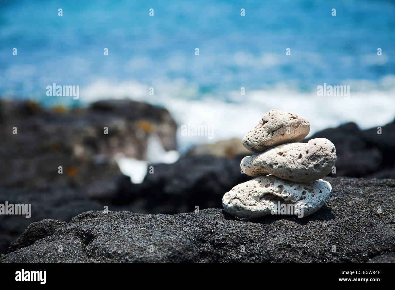 White Zen rocks on Hawaiian coastline with lava Stock Photo - Alamy