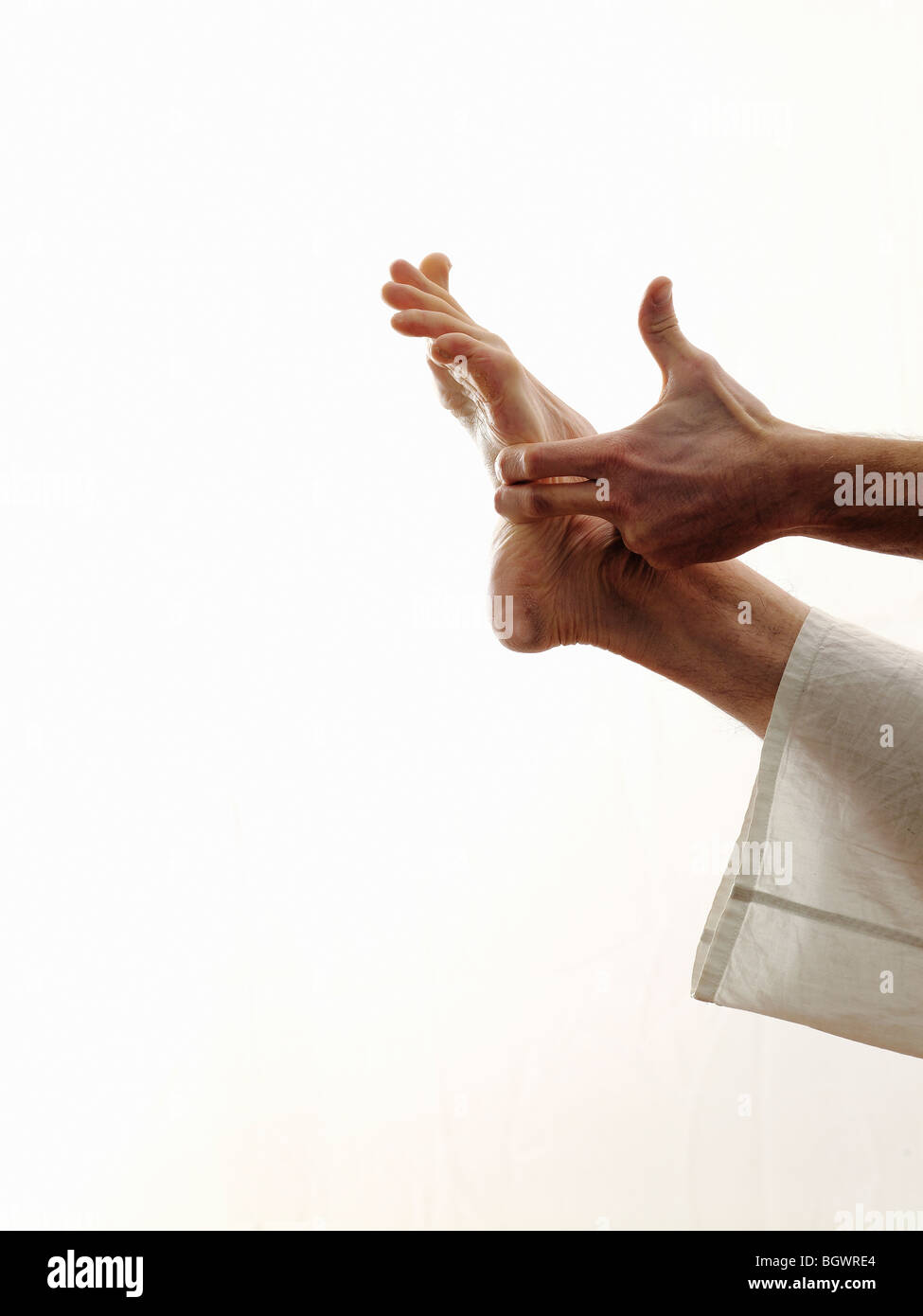 yoga pose hand and foot Stock Photo - Alamy
