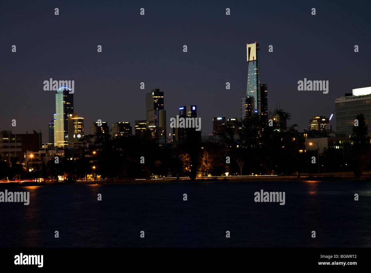 Melbourne skyline at dust, photographed from Albert Park Lake showing ...