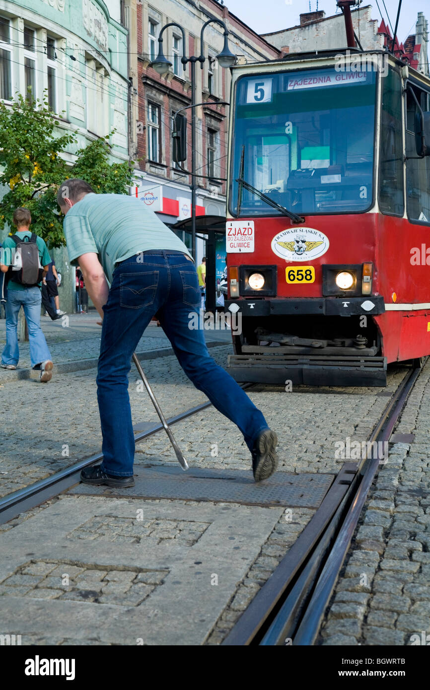 Tram driver setting the trams track points to a new line direction in ...