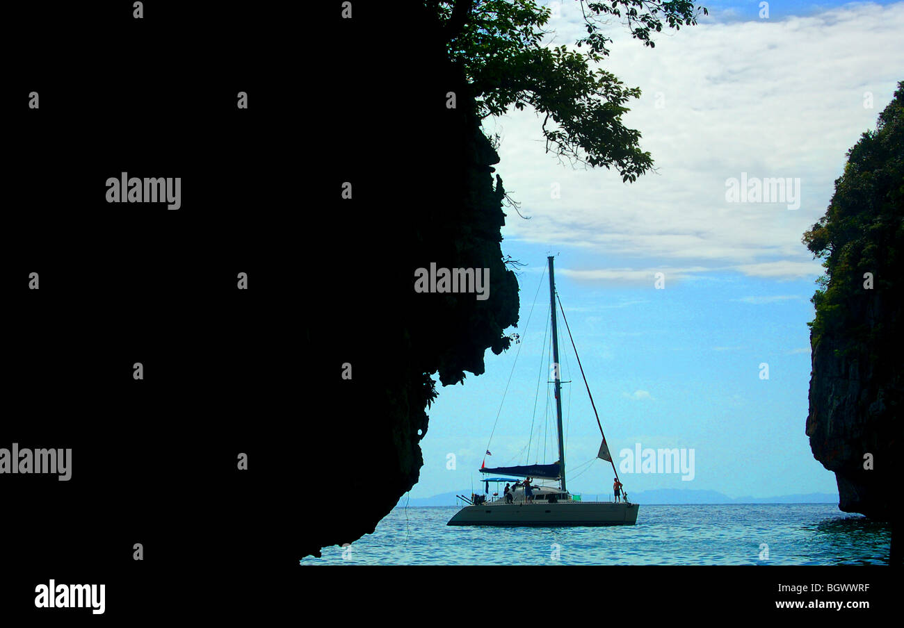 sailing boat between rocks Stock Photo - Alamy