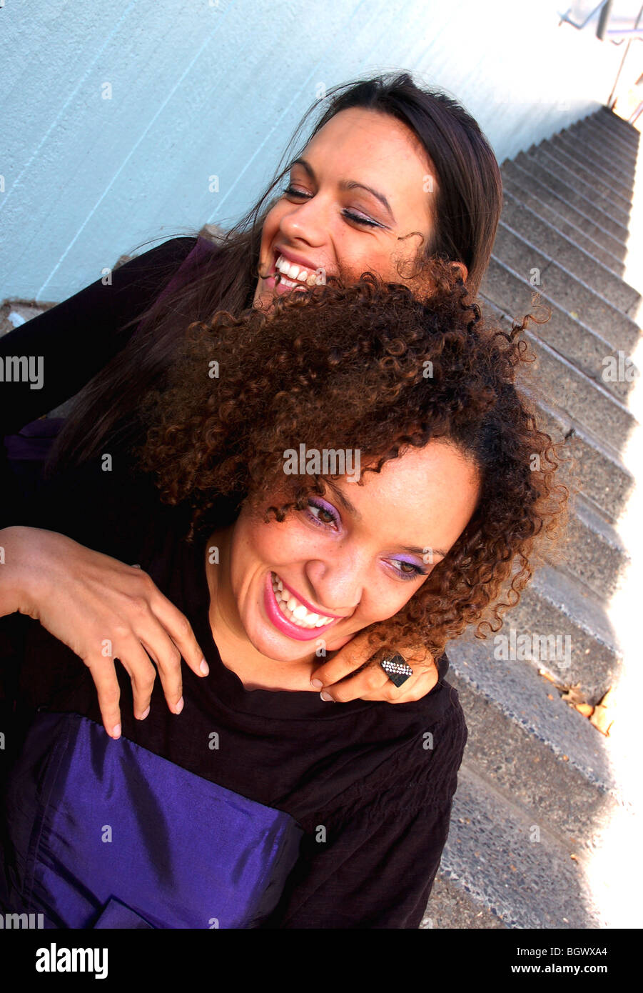 Two friends laughing Stock Photo - Alamy