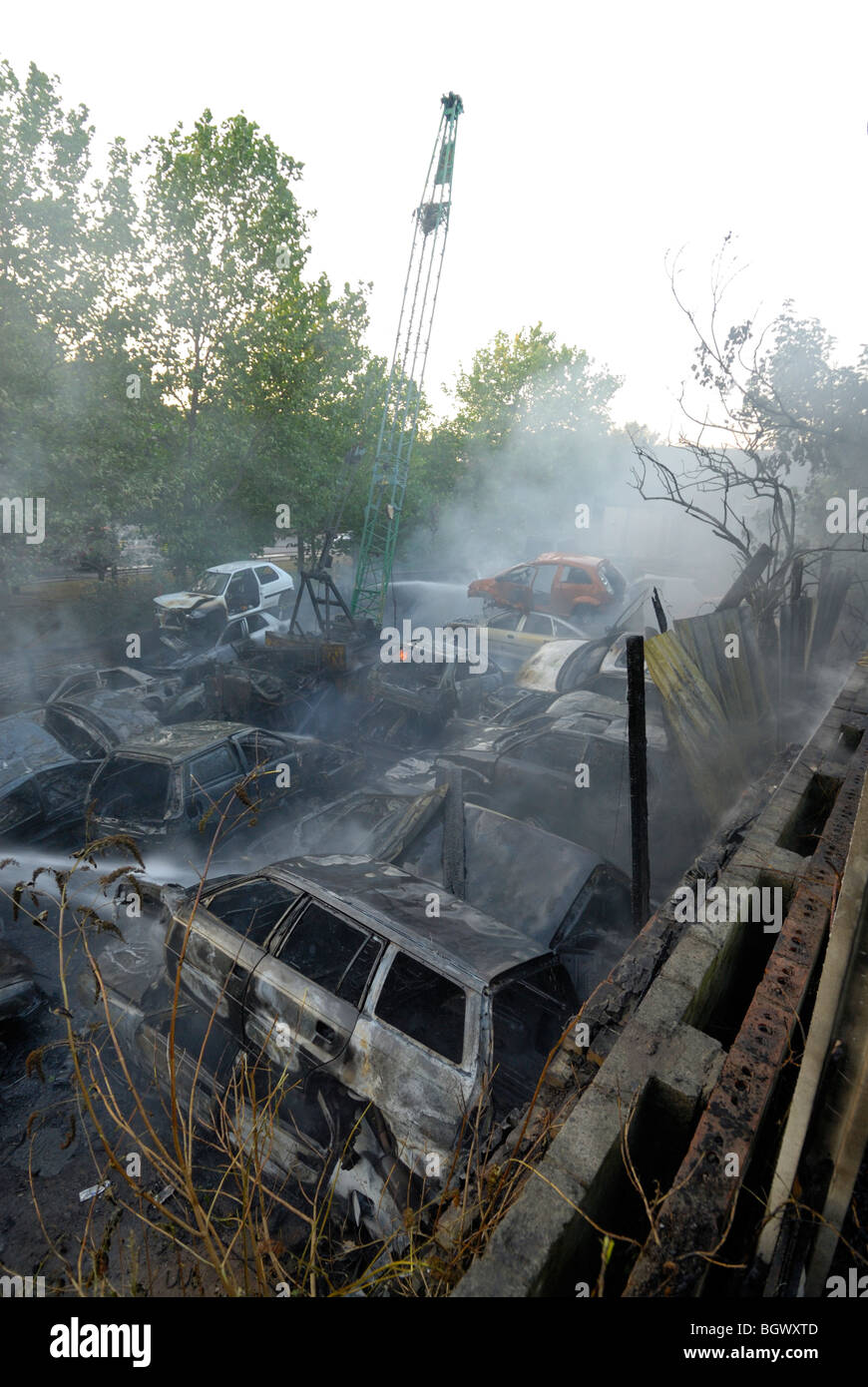 Car scrapyard on fire Stock Photo - Alamy