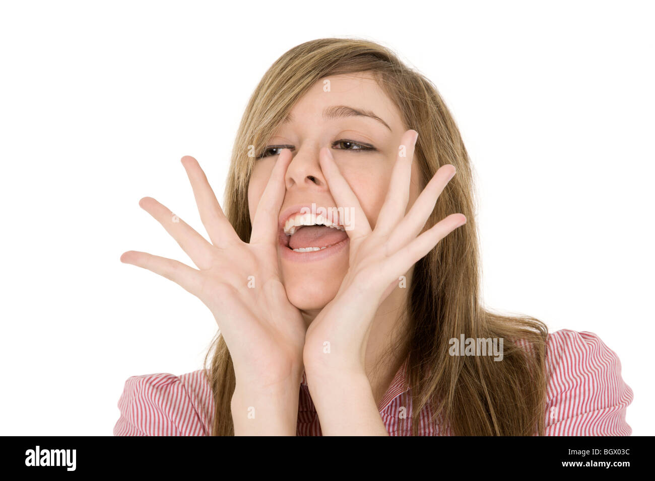 Caucasian teenager yelling at something on white background Stock Photo ...