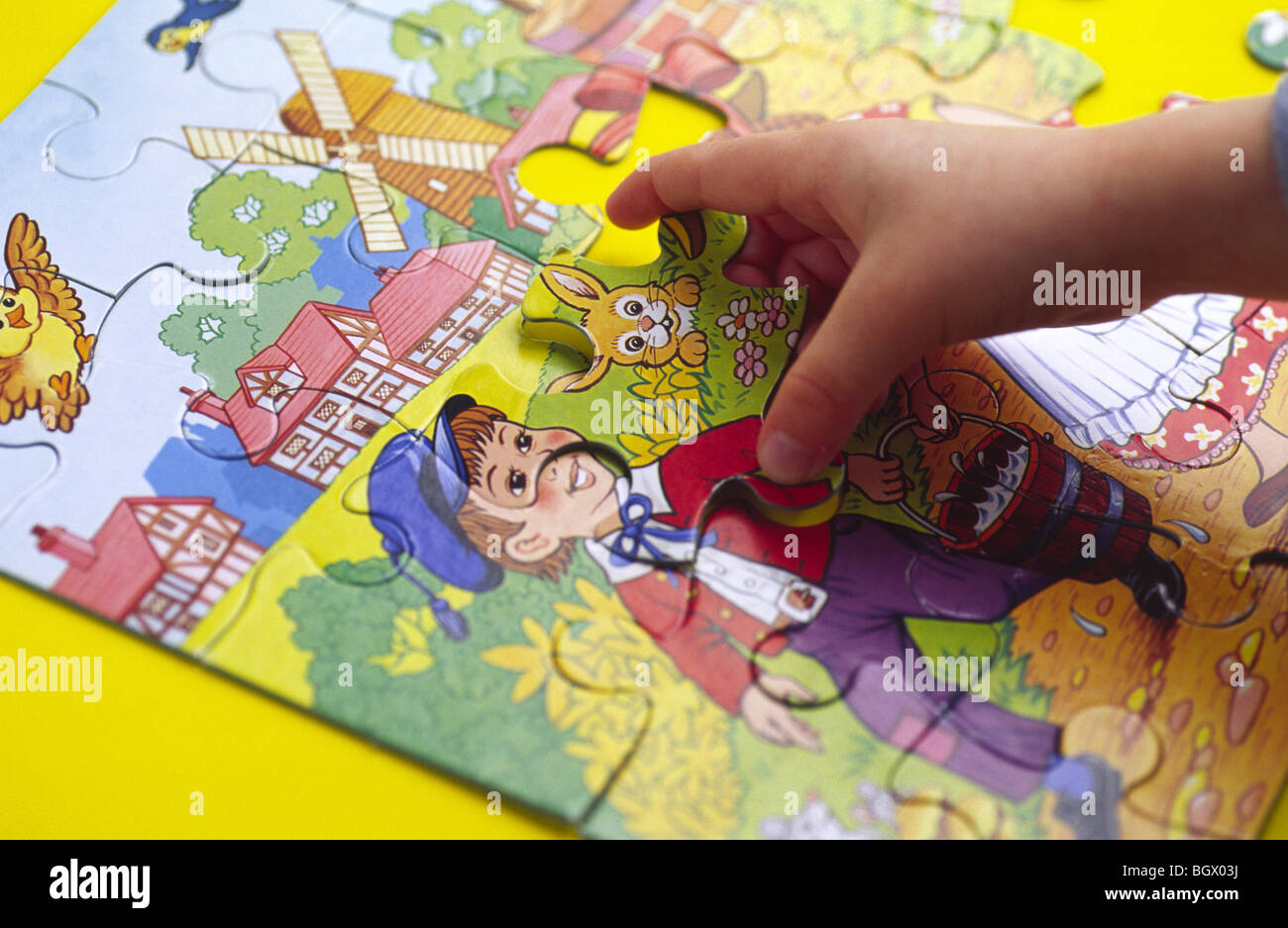 Child doing a jigsaw Stock Photo - Alamy