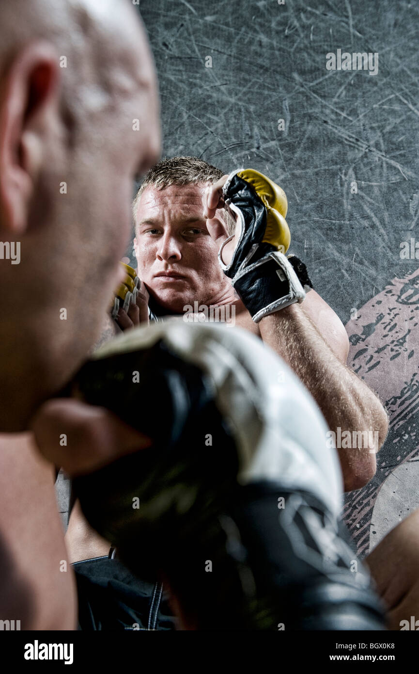 An action shot of an Ultimate Fighting Competition Stock Photo - Alamy