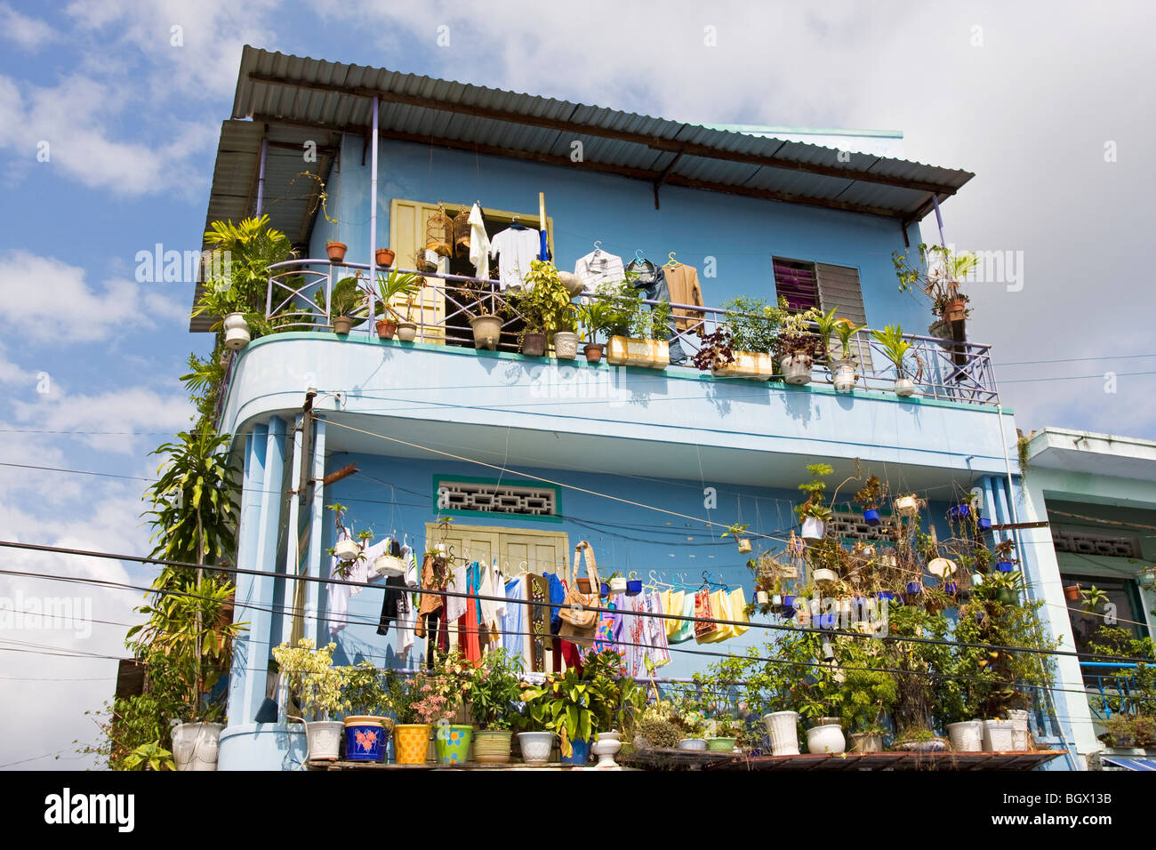 House in Vietnam with laundry drying on balconies Stock Photo - Alamy