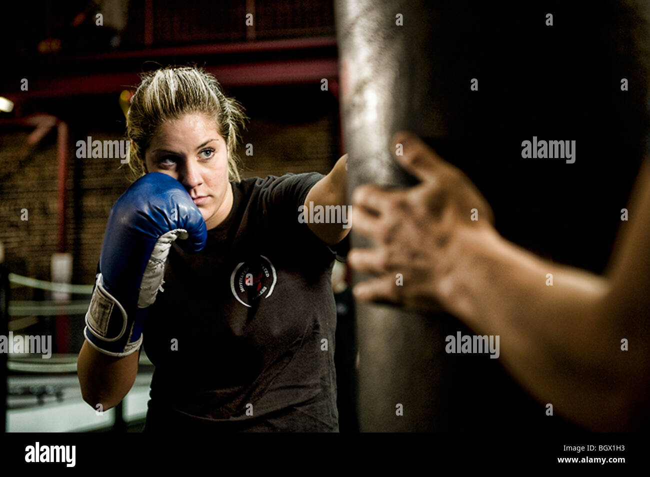 An action shot of a female boxer training Stock Photo - Alamy