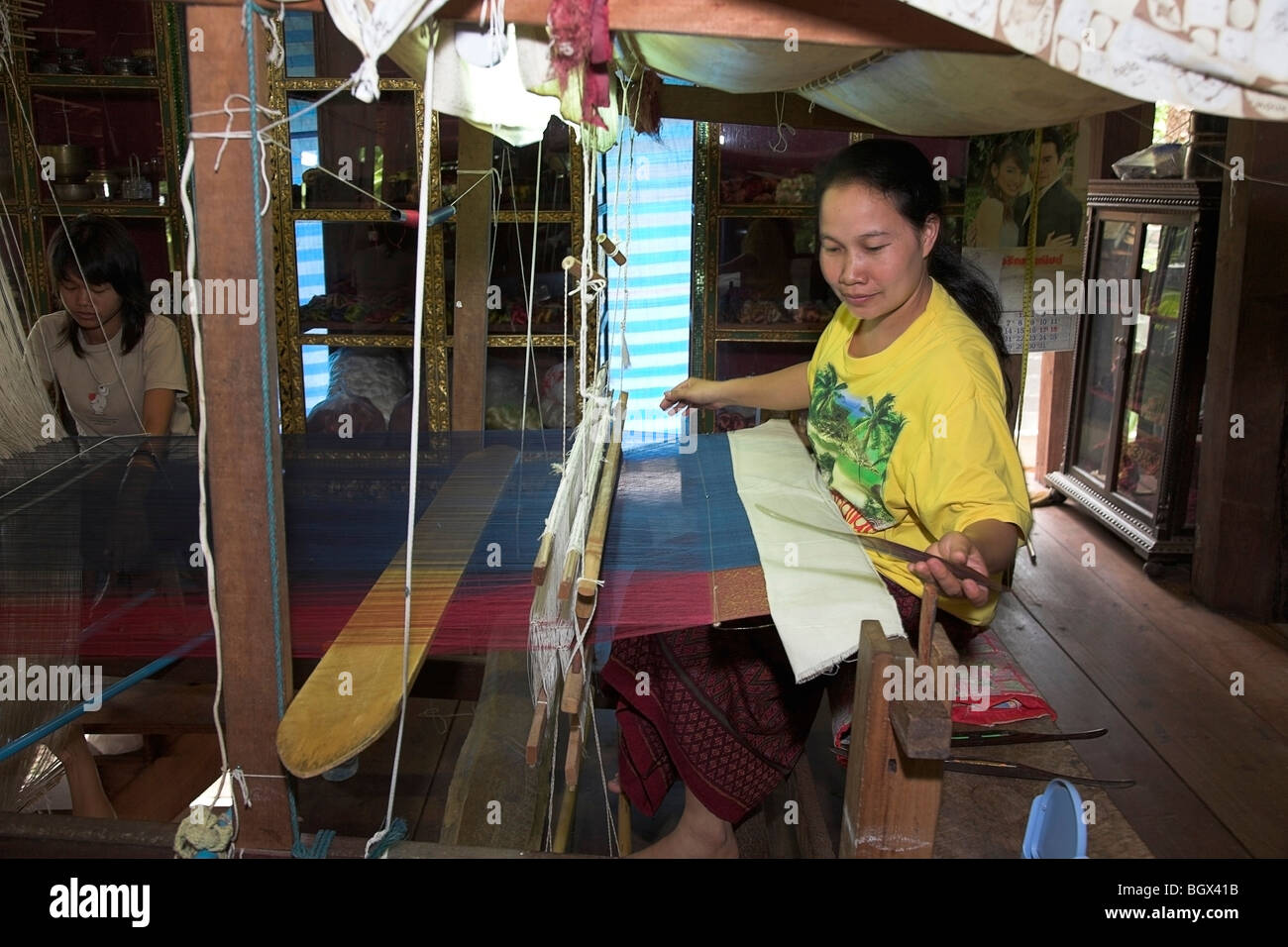 Woman making cloth on a loom Stock Photo - Alamy