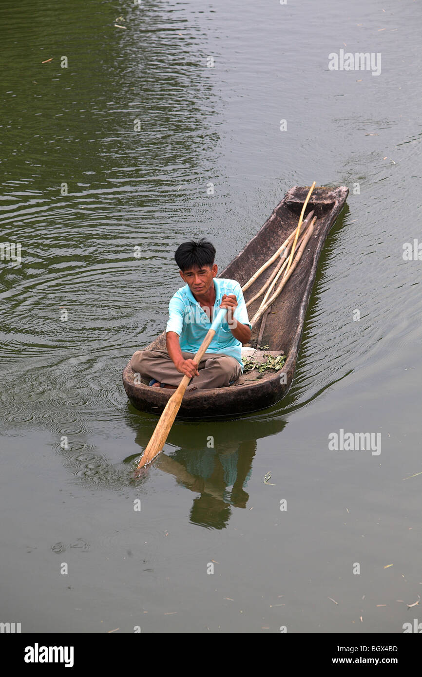 Man on a raft in a river Stock Photo - Alamy
