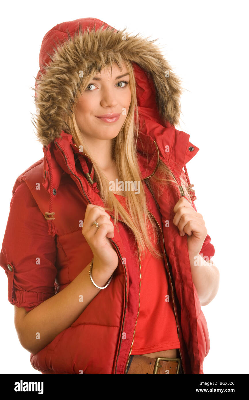 Portrait of young pretty woman wearing red hooded parka isolated on ...
