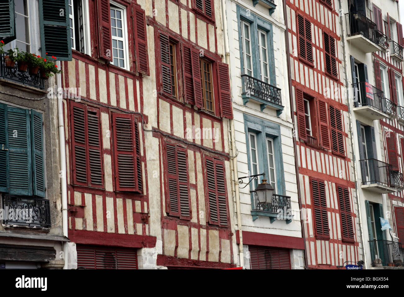 Quarter timbered buildings with shuttered windows Bayonne Bordeaux ...
