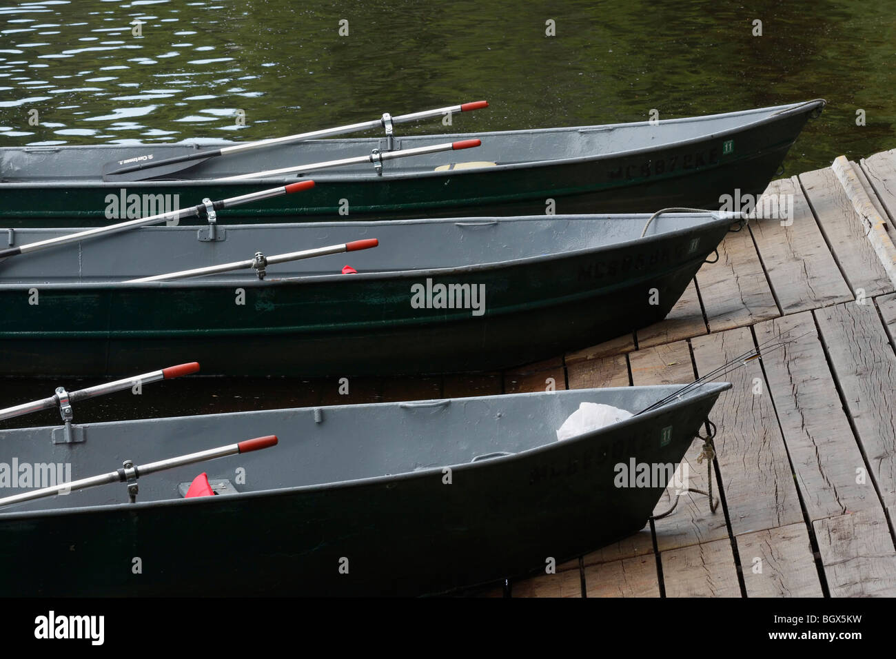 Empty tin boats anchored in the water tinny boats aluminum boat sculer ...
