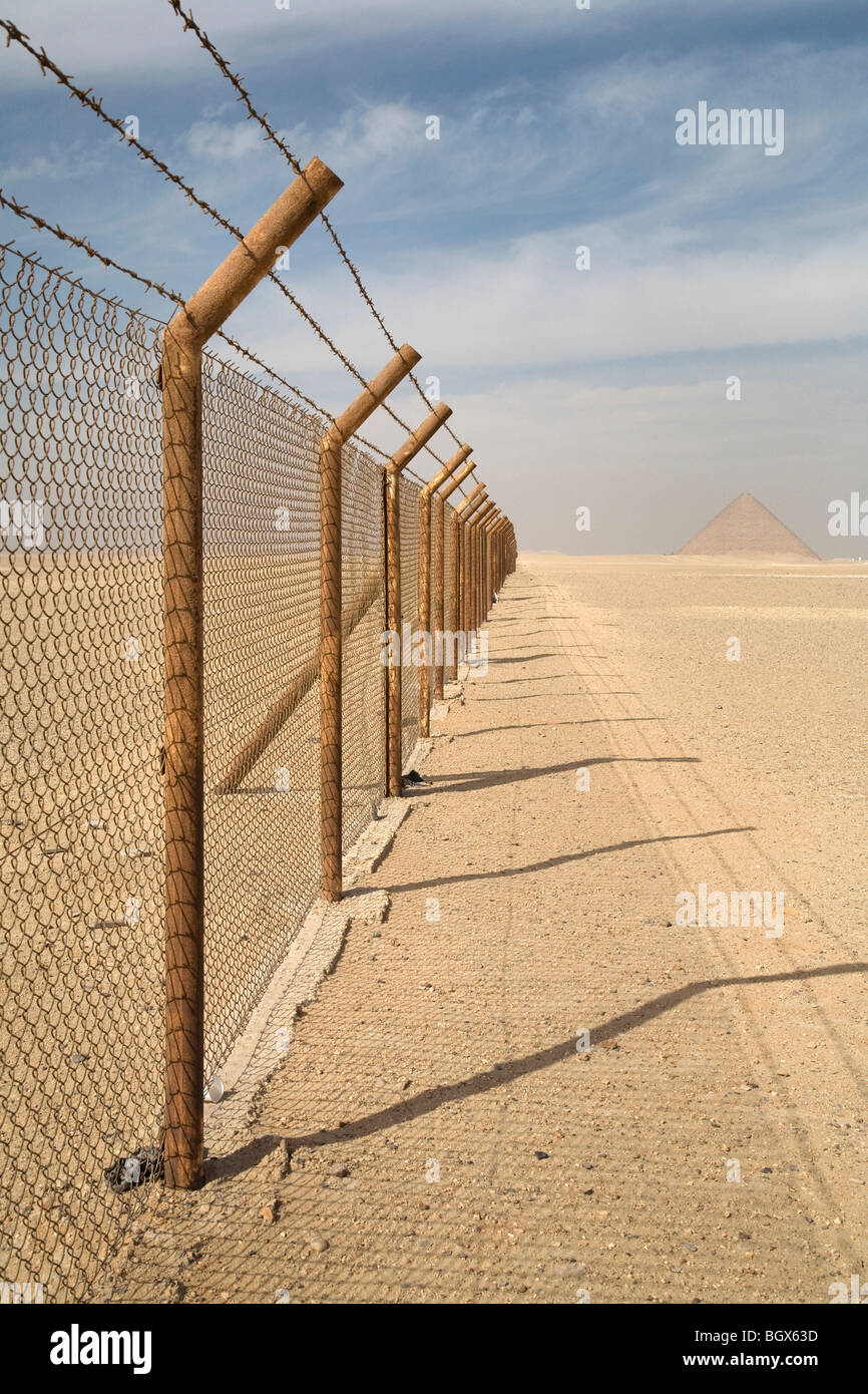 A barbed wire fence with Pyramid of Giza in background Stock Photo - Alamy