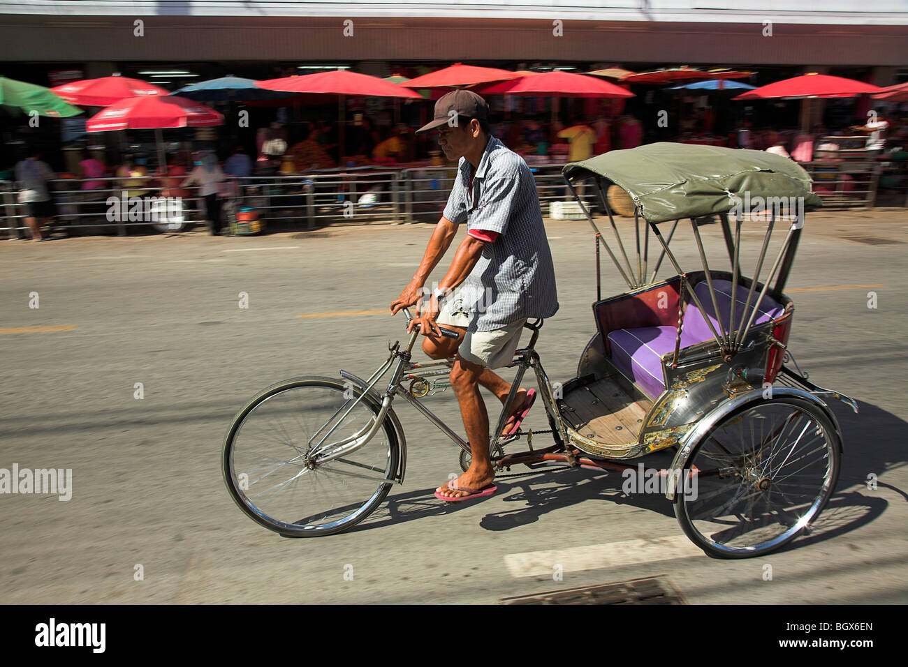Man on a tricycle Stock Photo - Alamy