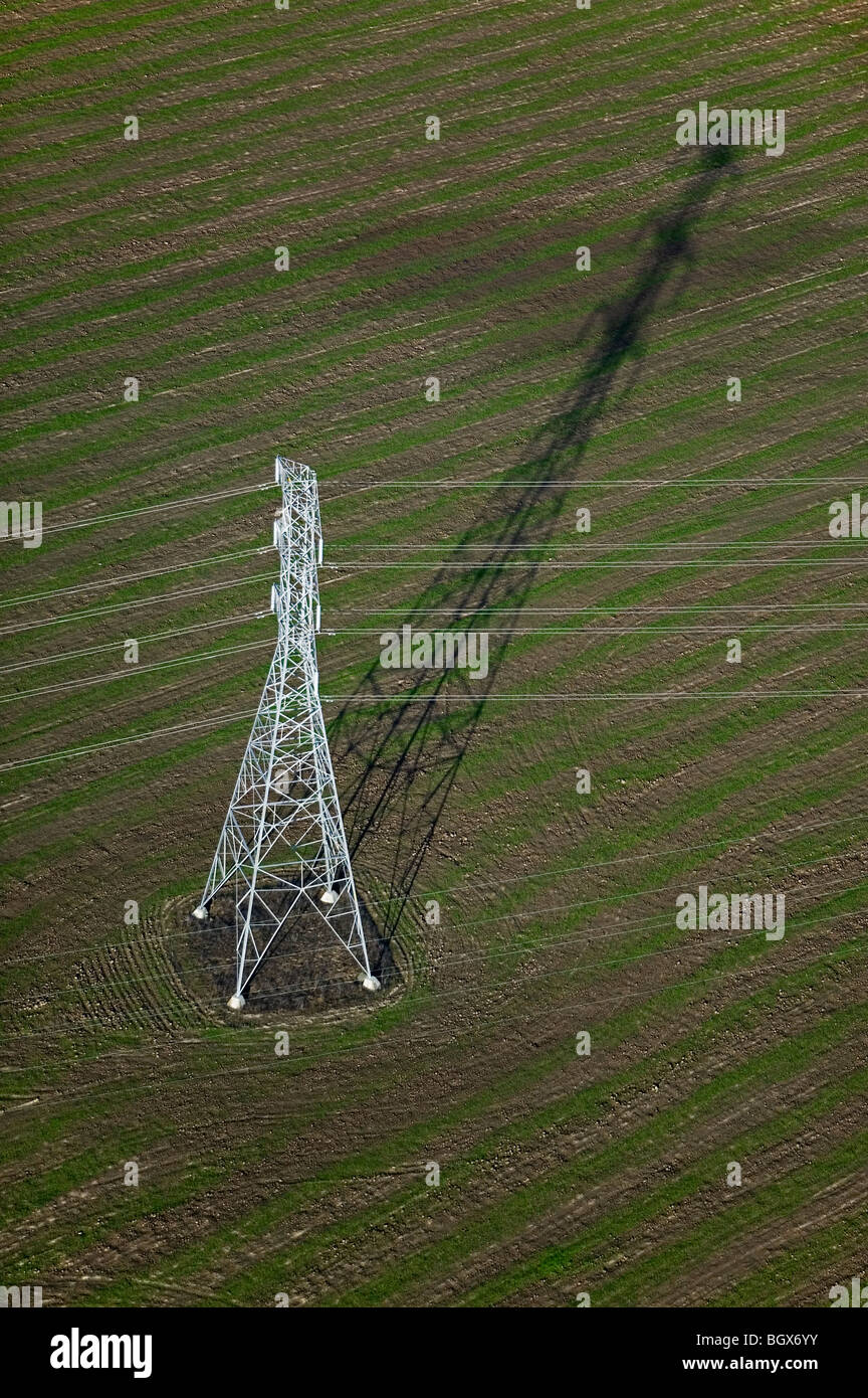 aerial view above high voltage electric transmission tower lines ...