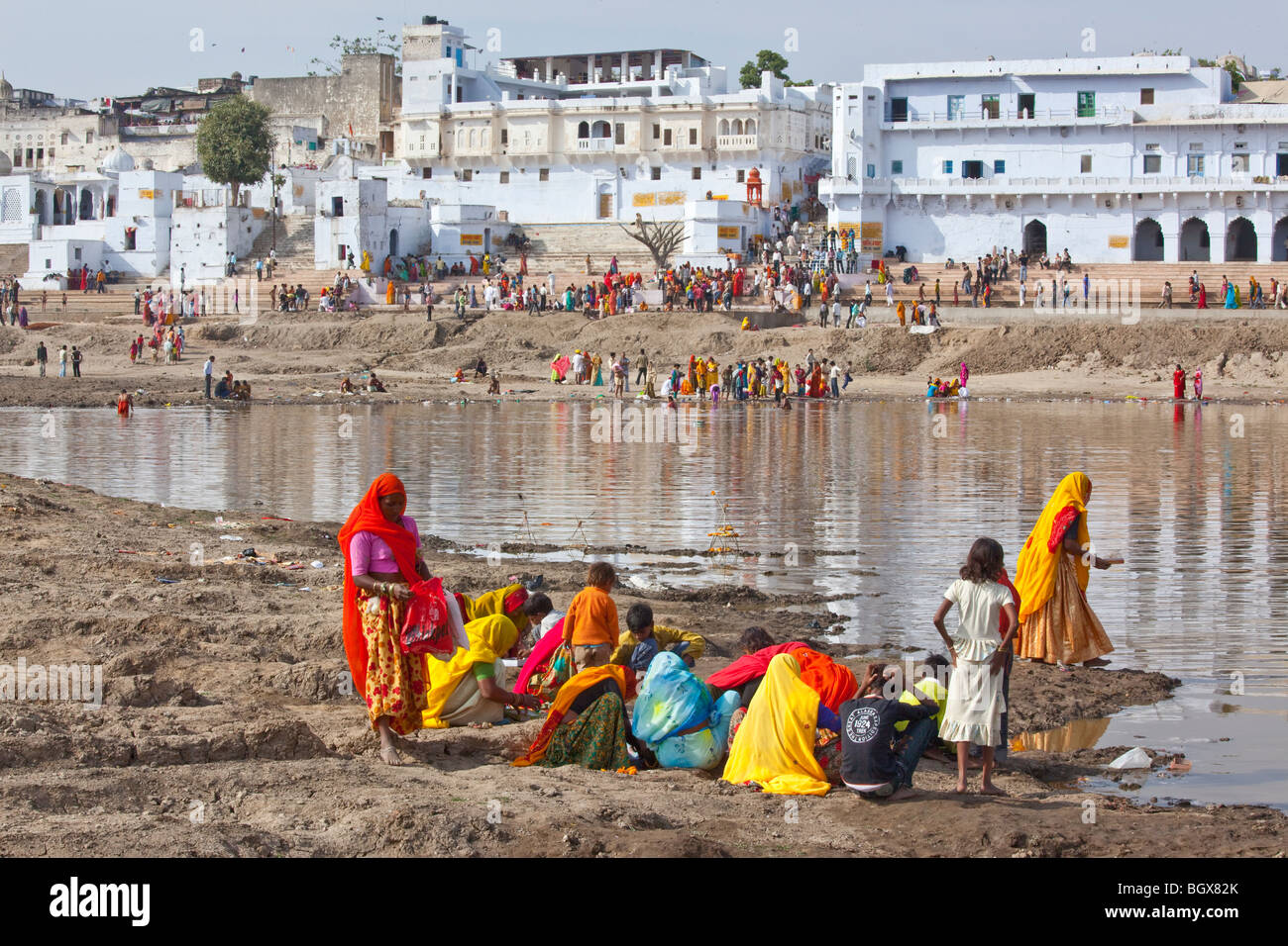 Pilgrims making offerings in the Lake during the Camel Festival in ...