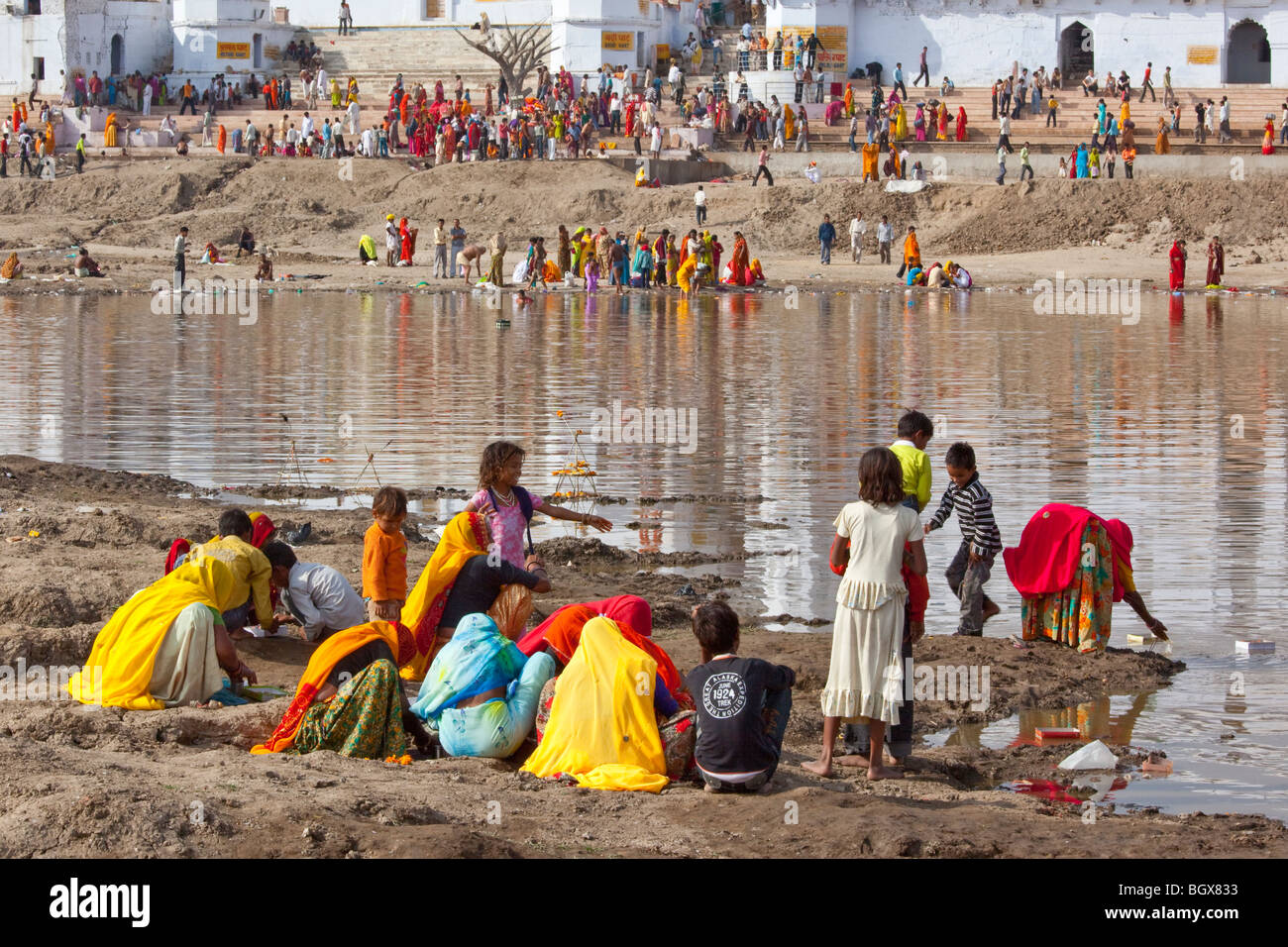 Pilgrims making offerings in the Lake during the Camel Festival in ...