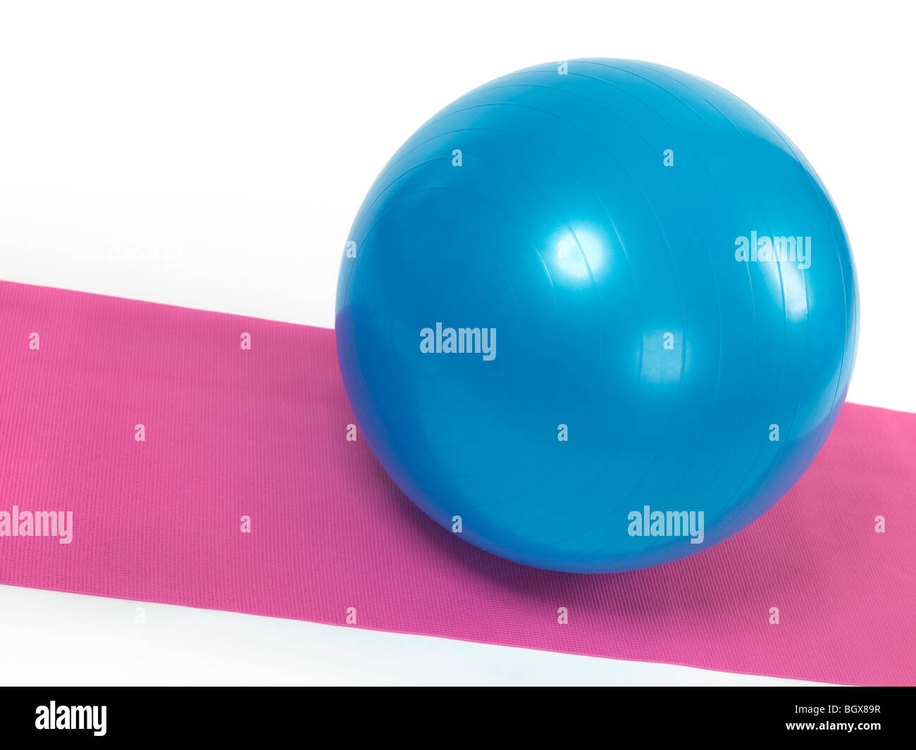 Blue fitness ball on purple mat isolated on white background Stock ...