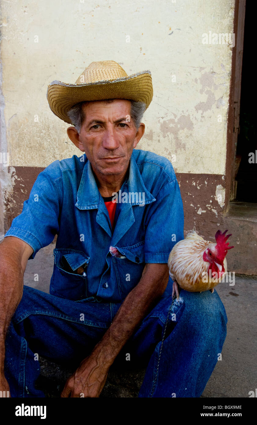 Old man with his chicken on streets of old village of Trinidad Cuba ...