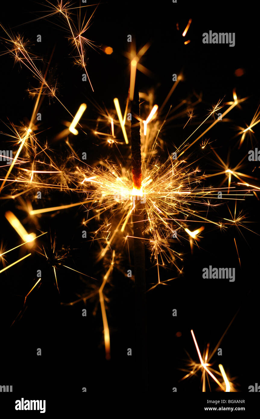 Closeup of a sparkler on a black background Stock Photo - Alamy