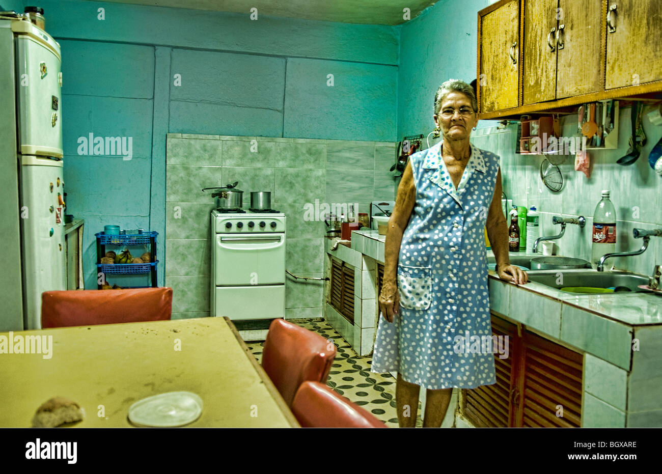 Woman in kitchen of local home in old colonial village in Trinidad Cuba ...