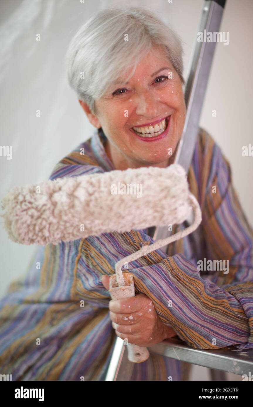 Mature woman doing DIY Stock Photo - Alamy