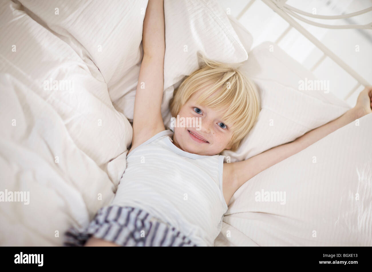 boy lying in bed Stock Photo - Alamy
