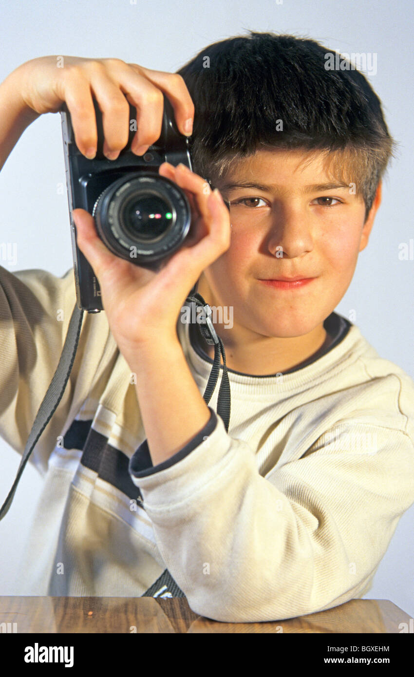 portrait of a young boy with a reflex camera Stock Photo - Alamy