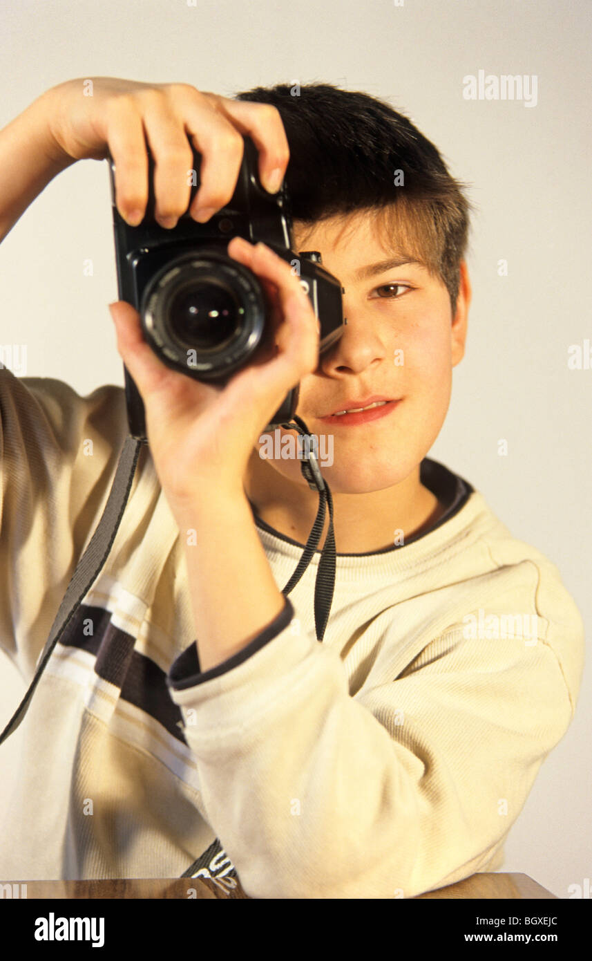 portrait of a young boy with a reflex camera Stock Photo - Alamy