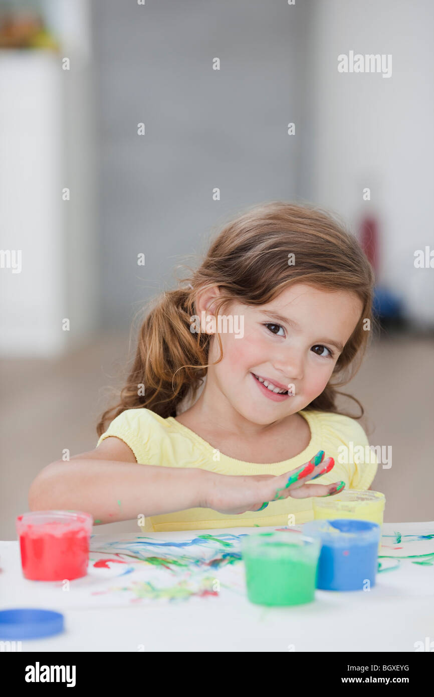 young girl playing with colours Stock Photo - Alamy