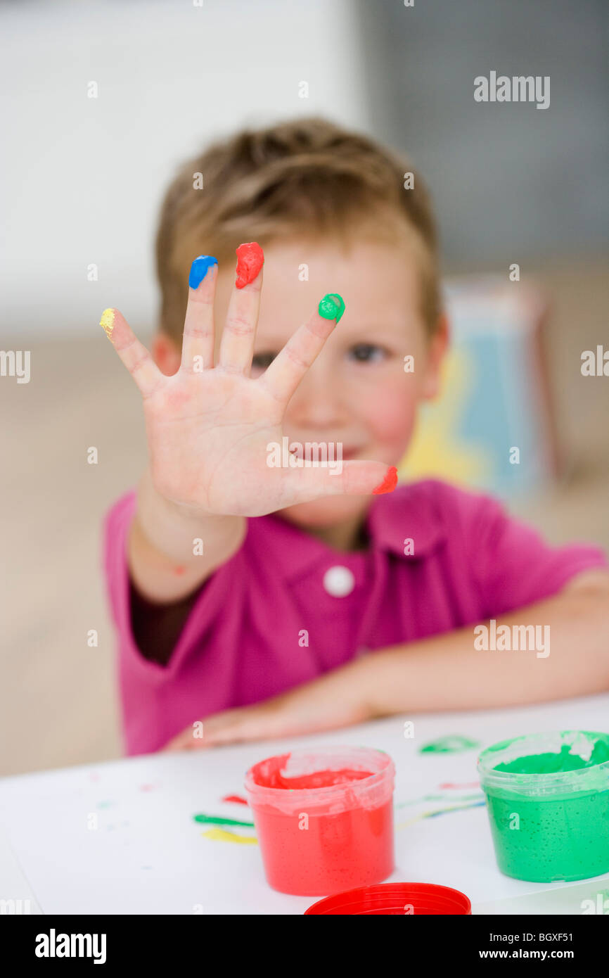 young boy playing with colours Stock Photo - Alamy