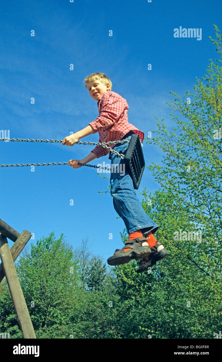 young boy on a swing Stock Photo - Alamy