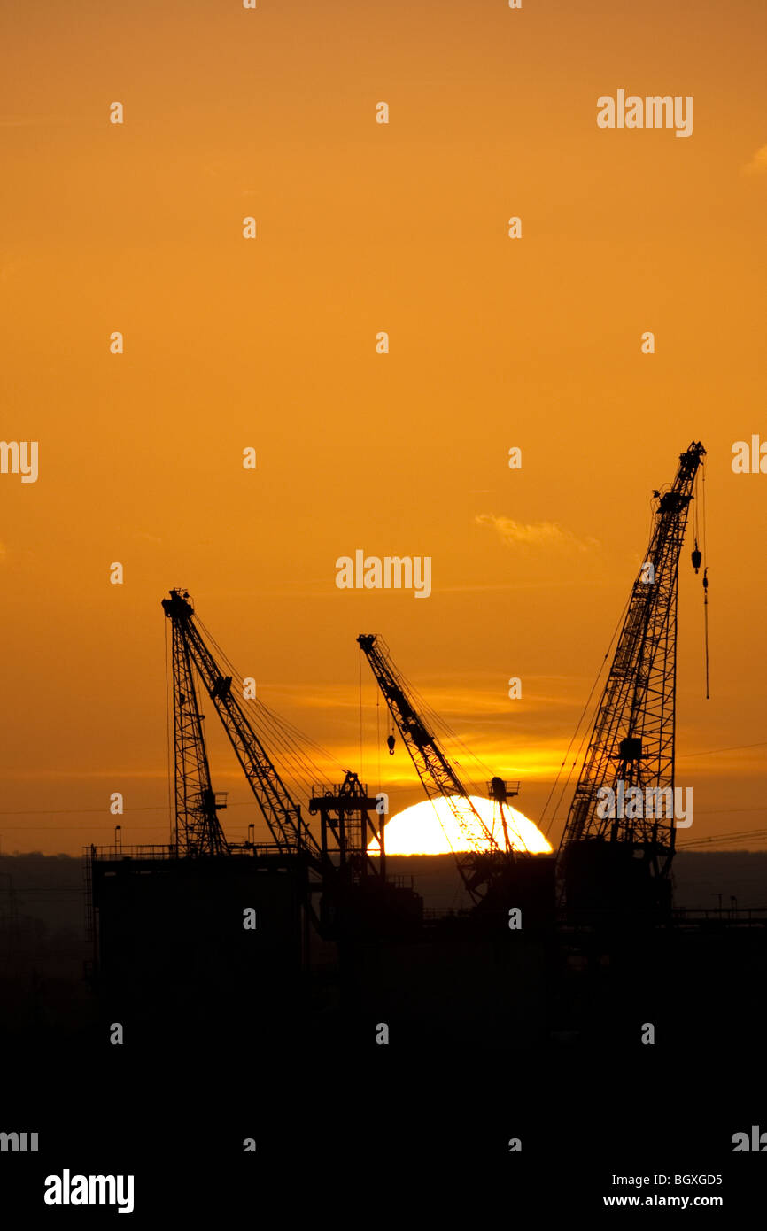 Sunset over cranes at Ridham Dock an independently run port on the ...