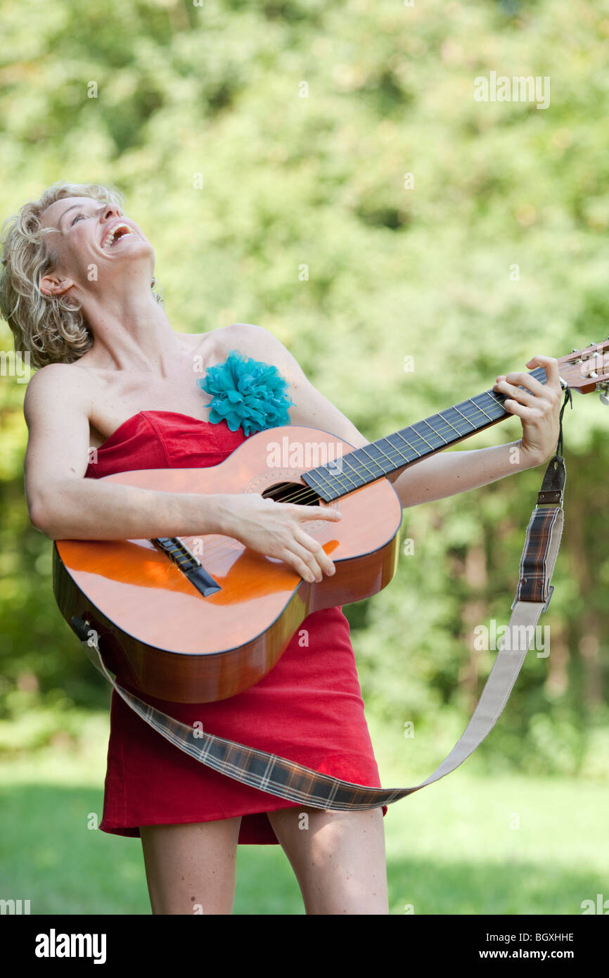 woman playing guitar Stock Photo - Alamy