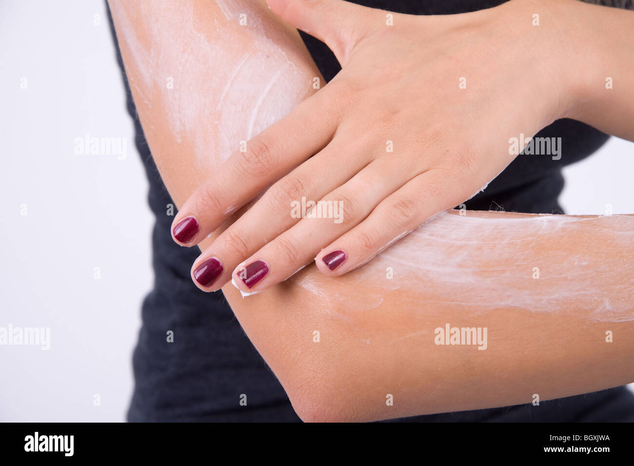 Woman apply cream elbow hi-res stock photography and images - Alamy