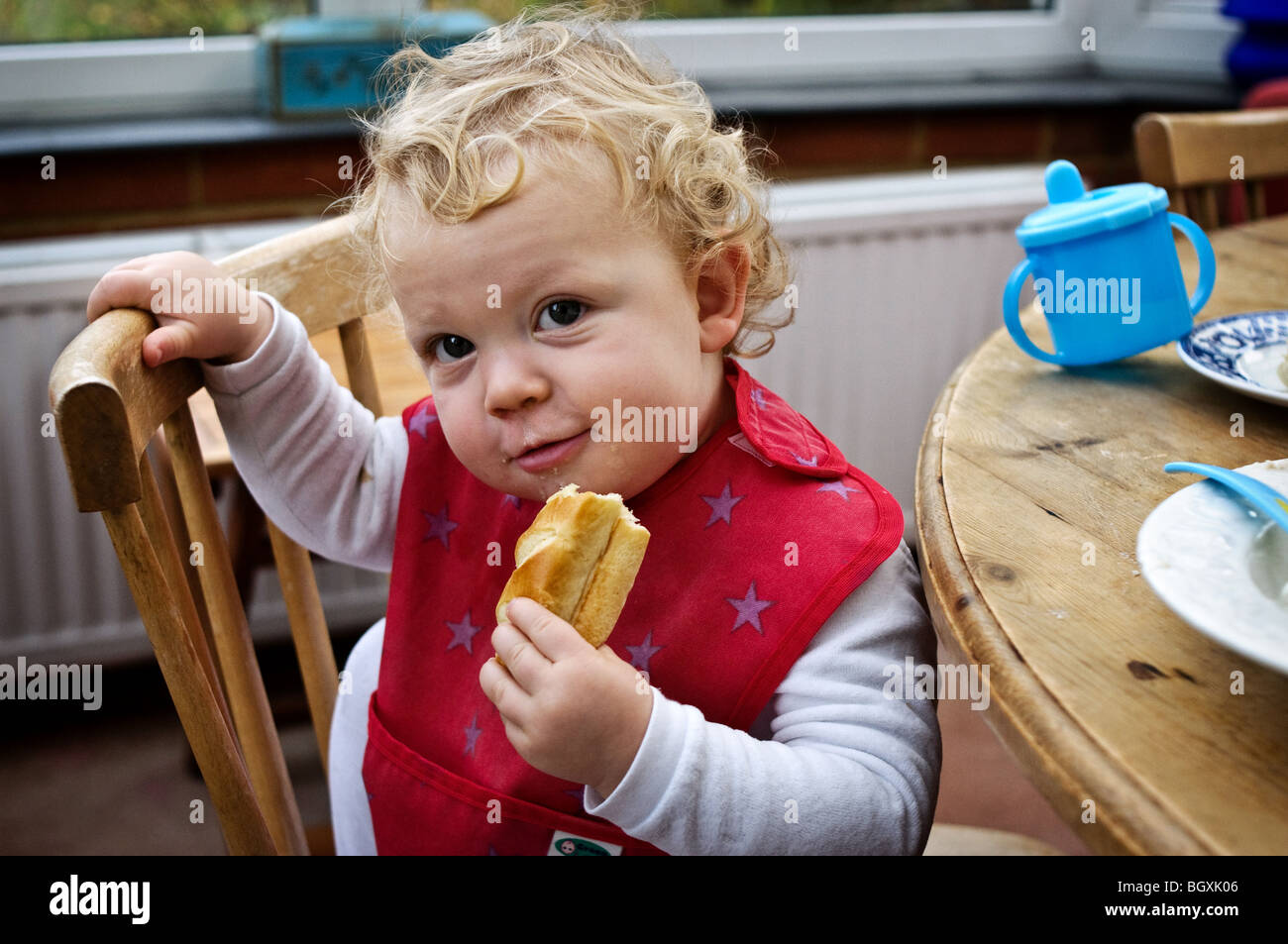 Young boy at the breakfast table Stock Photo - Alamy
