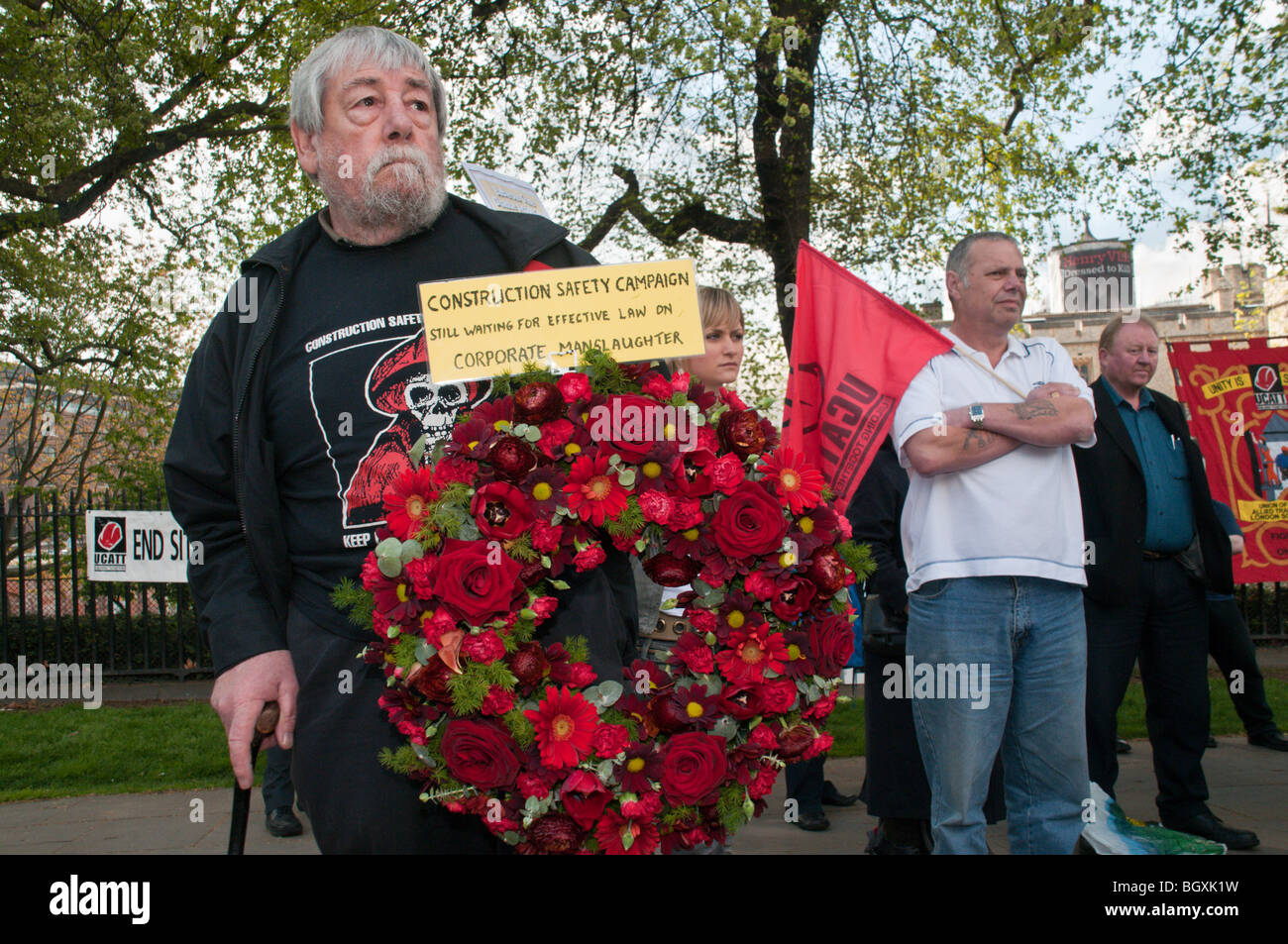 International Workers Memorial Day. Man holds Construction Safety ...
