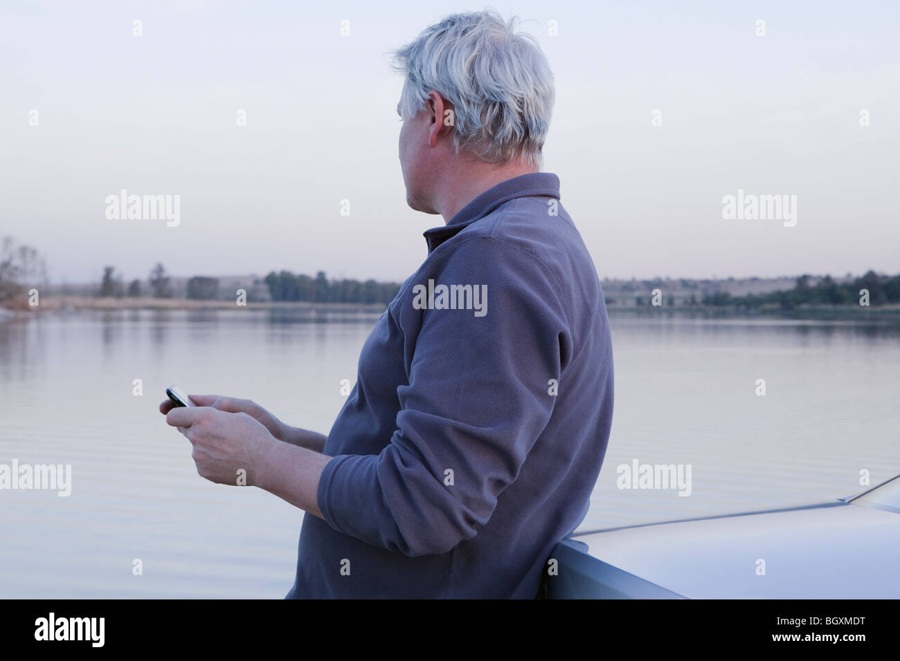Man holding mobile phone Stock Photo - Alamy