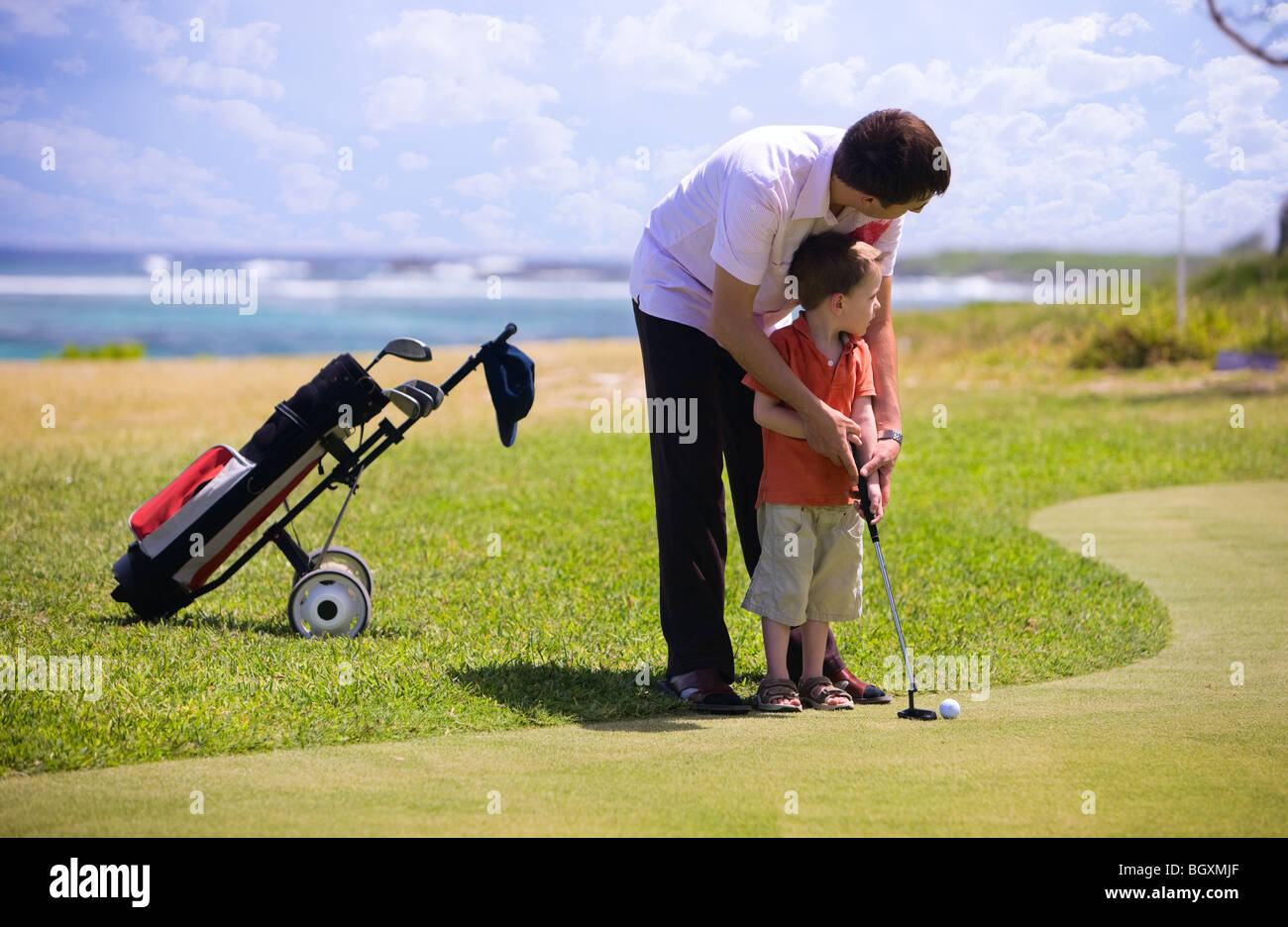 Kid and father golf hi-res stock photography and images - Alamy