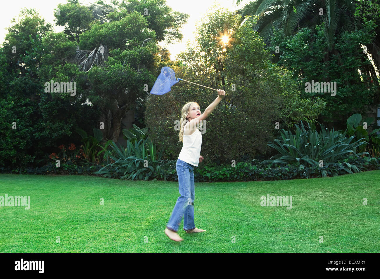 Girl holding butterfly net Stock Photo - Alamy